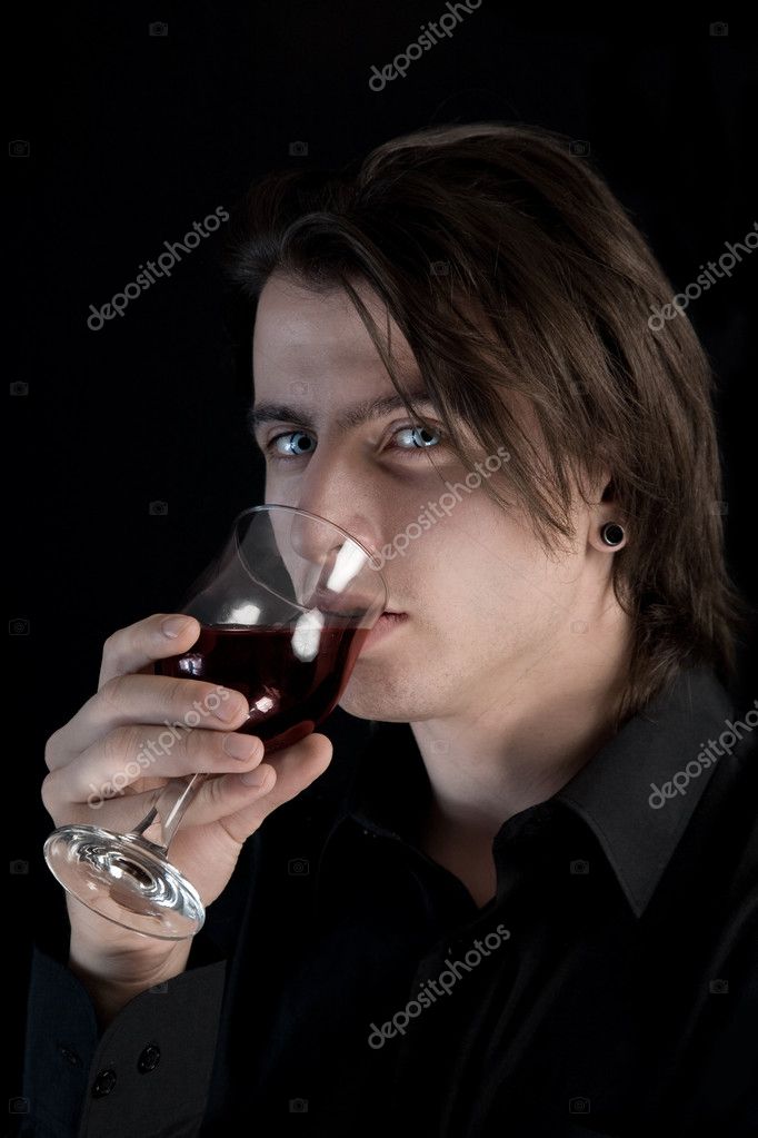 Handsome pale vampire with blue eyes dri Stock Photo by ©Elisanth 1045027