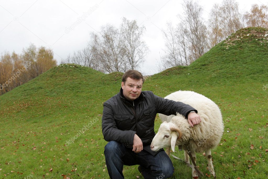 Man and sheep — Stock Photo © AChubykin #1086736