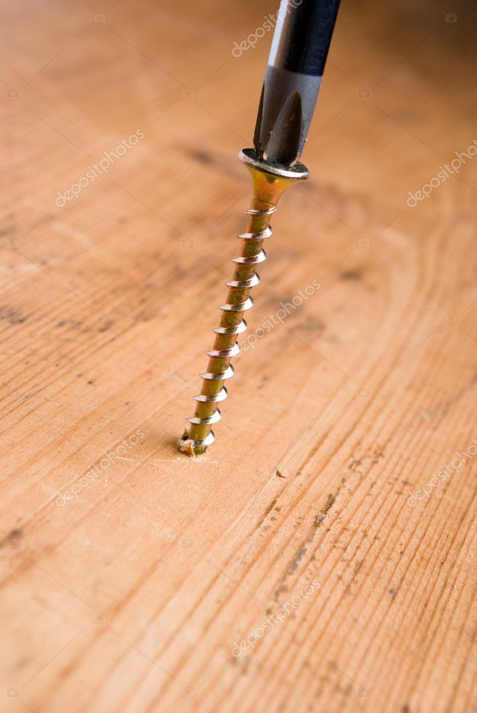 Screw being screwed into a piece of wood — Stock Photo © fanfon #1117881