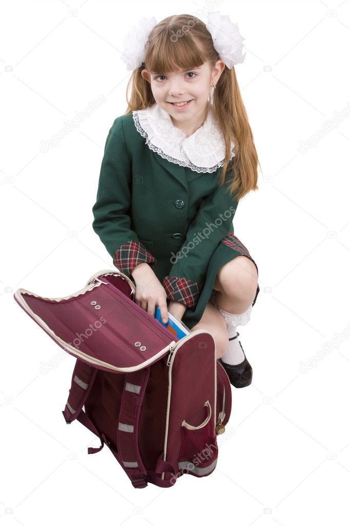 School girl is packing up backpack. — Stock Photo © Irkusnya #1166936