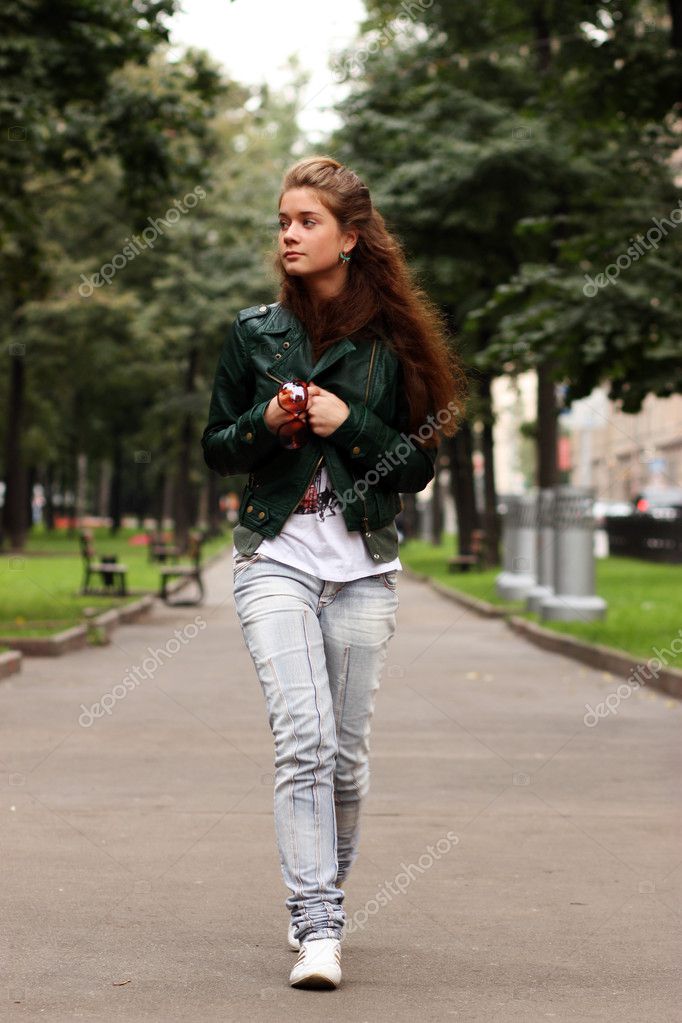 Walking woman in blue jeans ⬇ Stock Photo, Image by © arkusha #1321943
