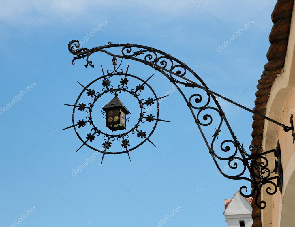 Medieval wrought iron shop sign Stock Photo by ©slavapolo 2040910