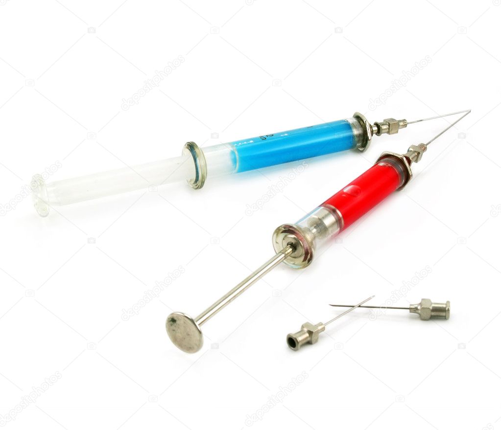 Two syringes with acid substance Stock Photo by ©alphacell 1304891