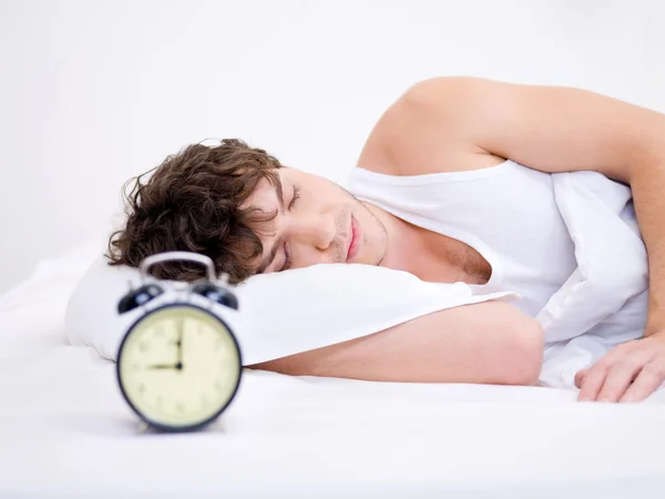 Man sleeping with alarm clock — Stock Photo © valuavitaly #1538002 Man sleeping with alarm clock — Stock Photo © valuavitaly #1538002