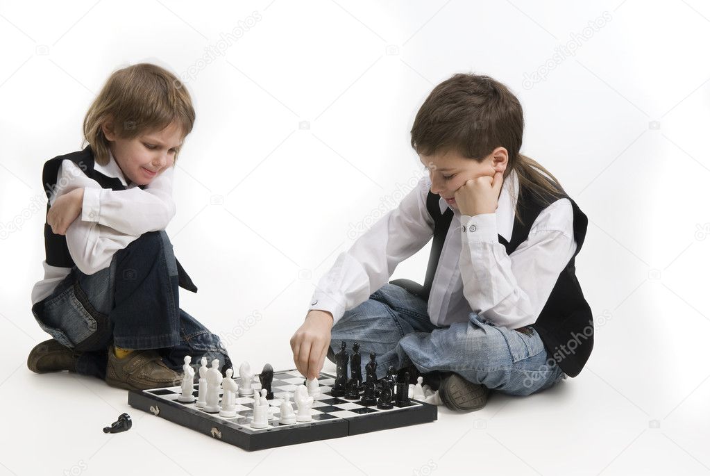 Boys playing a chess. Stock Photo by ©margaryta 1642300