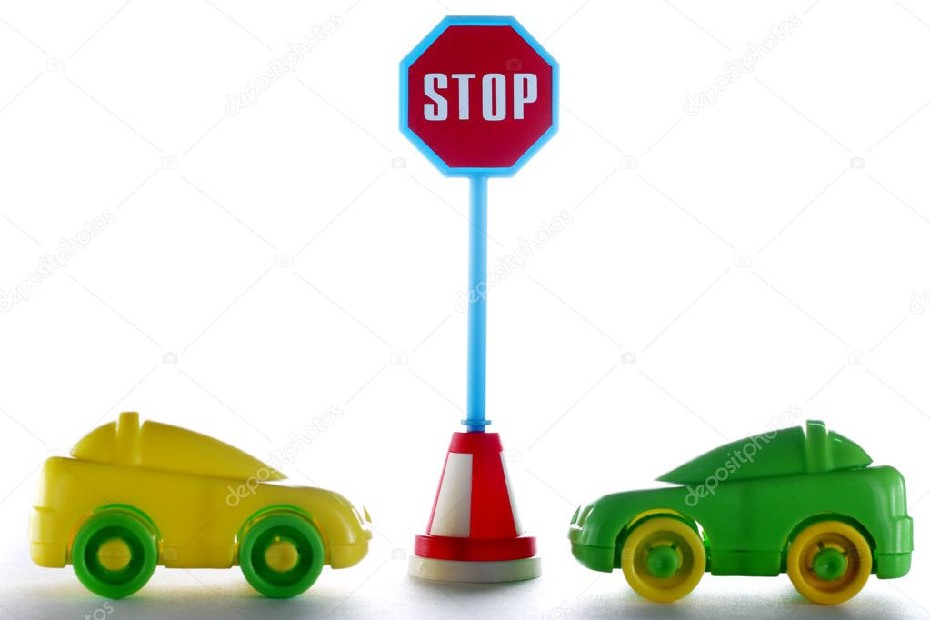 A couple cars behind stop road sign — Stock Photo © DedMorozz #2386380