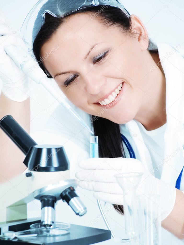 Female researcher holding test Stock Photo by ©ayo888 2095791