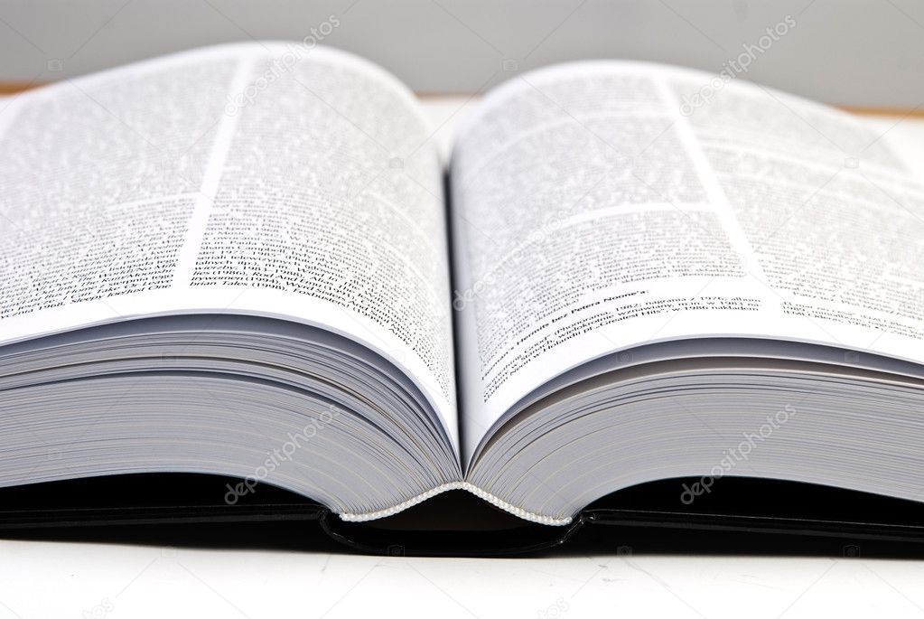 Opened big hefty book on the table Stock Photo by ©tarczas 1689878