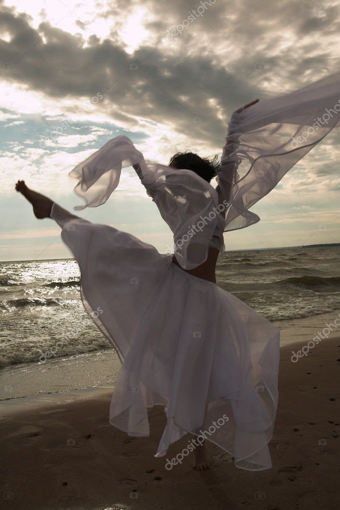 Woman dancing on the beach — Stock Photo © kanareva #1670130