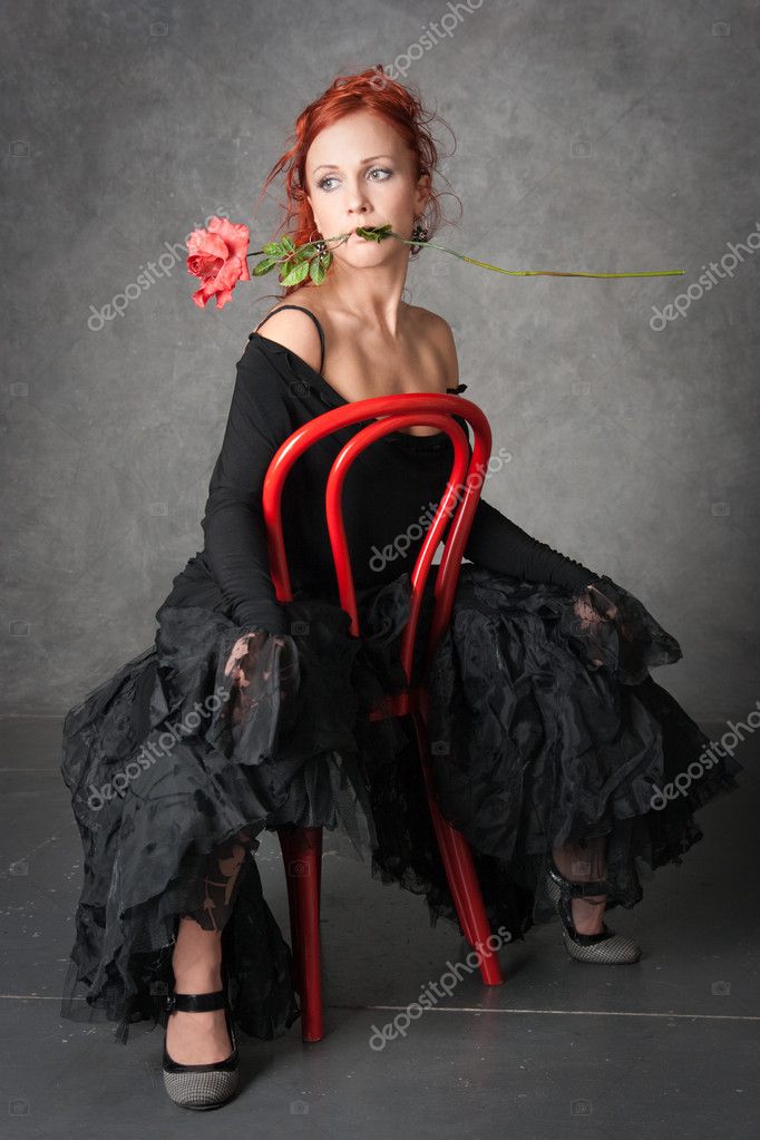 The charming girl with a red rose — Stock Photo © fotoksa #2638833