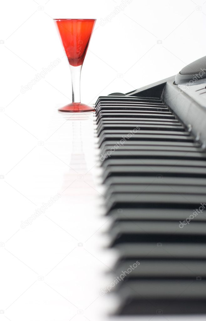 Piano keyboard and red glass — Stock Photo © mihhailov #1775032