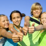 Smiling group of kids or children with thumbs up — Stock Photo ...