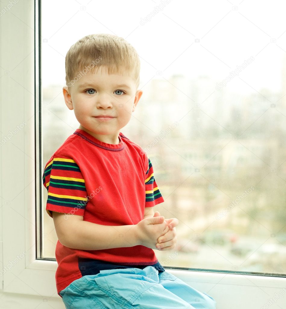 Boy sits on a window — Stock Photo © ababaka #1951183