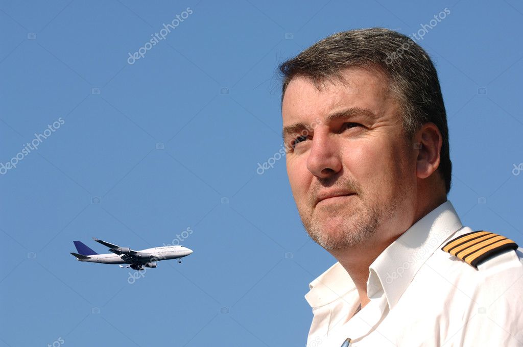 Pilot posing outdoors Stock Photo by ©Editorial 2292036