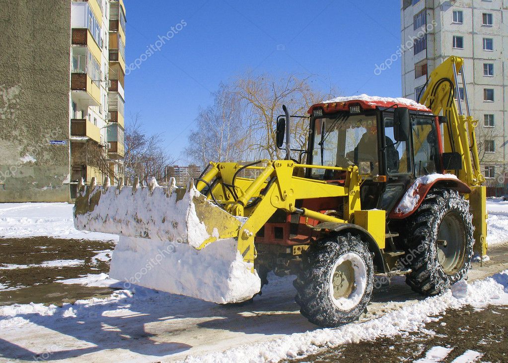 Tractor for snow cleaning Stock Photo by ©Valeras 2624495
