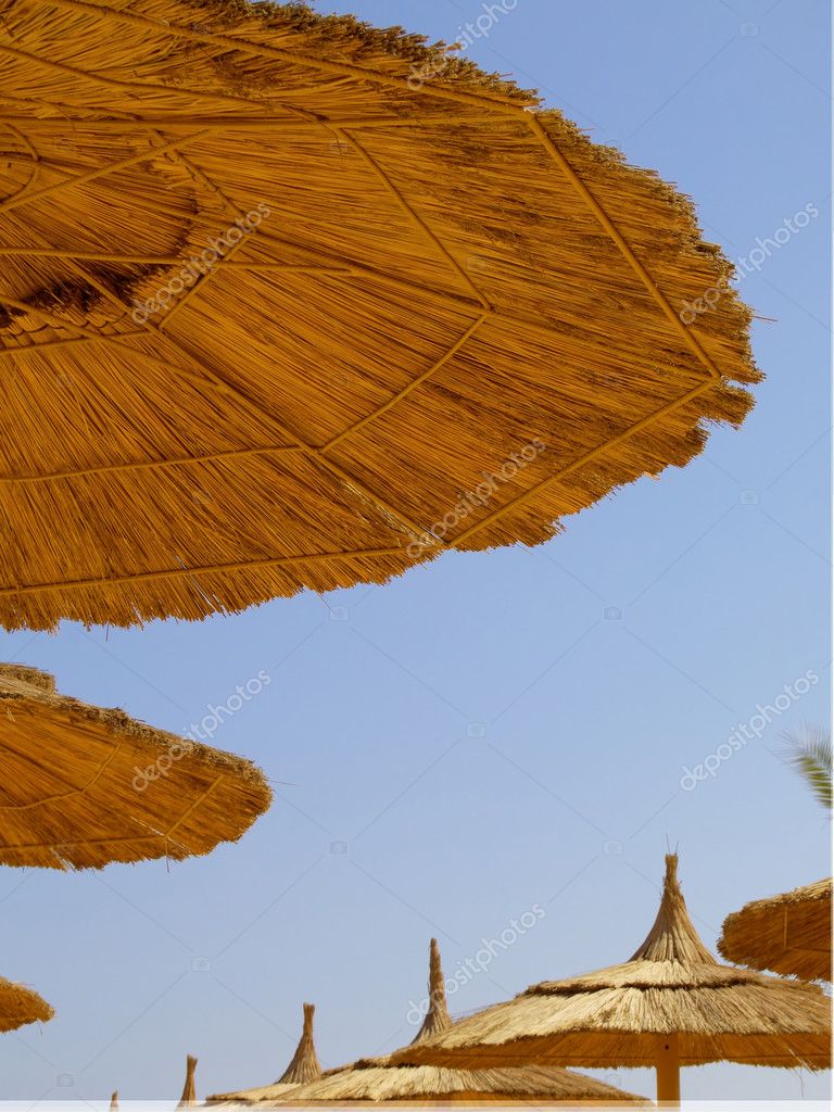 Straw parasols — Stock Photo © Tonygers #2223527