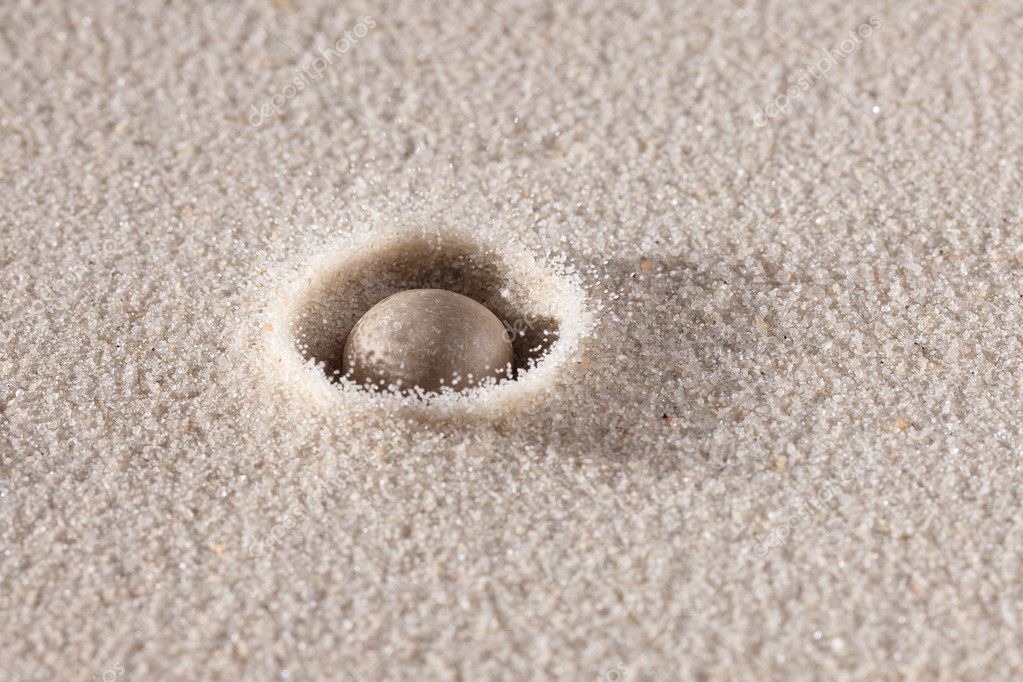 Stone falling down in sand — Stock Photo © jirkaejc #2263893