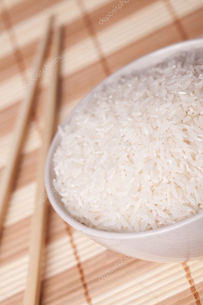 White rice in bowl and chopsticks — Stock Photo © jirkaejc #2264202