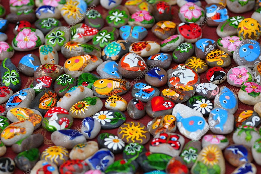 Painted stones animals | Painted symbols on the stones — Stock Photo ...