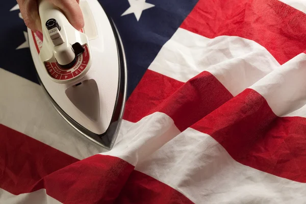 Ironing Out the Wrinkles in U.S. Flag — Stock Photo © Feverpitch #2328470