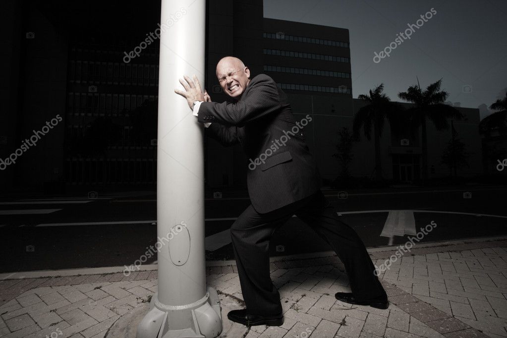 Man holding a falling column Stock Photo by ©felixtm 2588631
