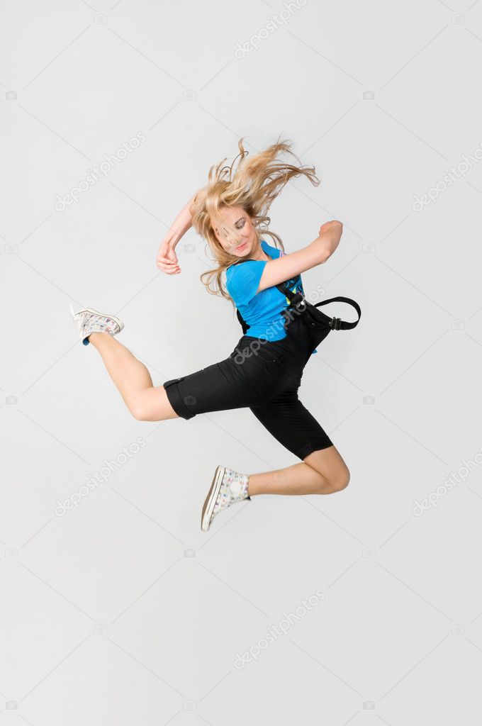 Beautiful girl jumping high Stock Photo by ©nikitabuida 2354416