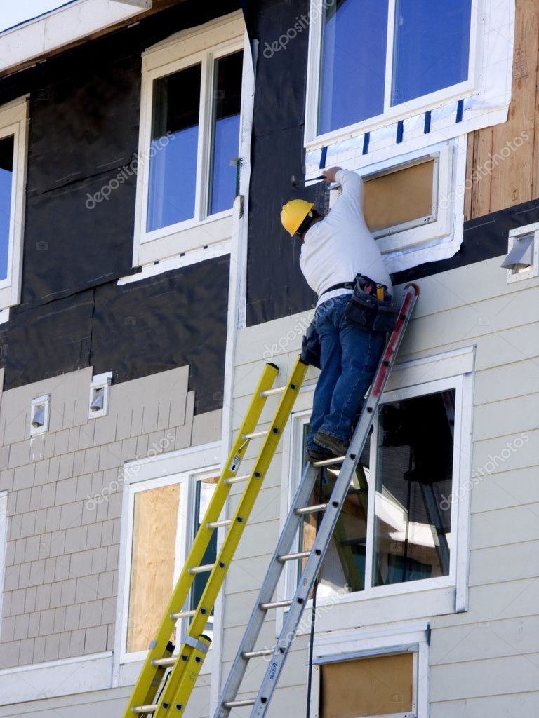 Man Hanging Siding - Construction Stock Photo by ©scamp65 2636548